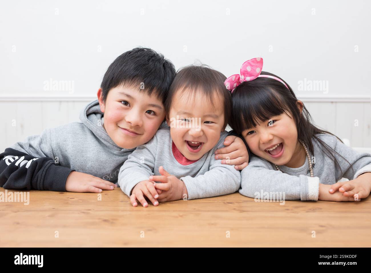 Siblings, siblings, three siblings Stock Photo - Alamy