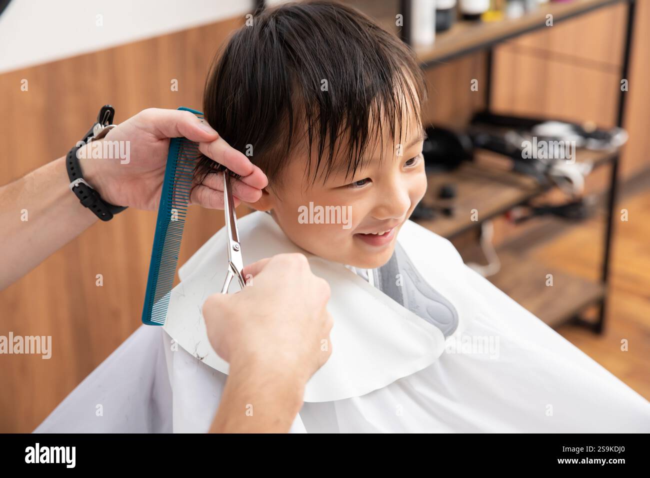 Boy getting haircut in beauty salon, haircut Stock Photo - Alamy