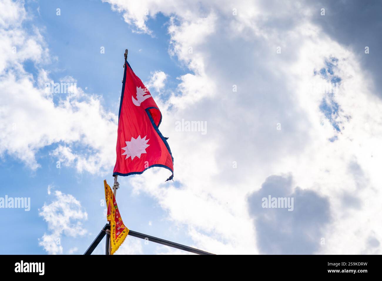 Nepal flying against cloudy sky Stock Photo - Alamy