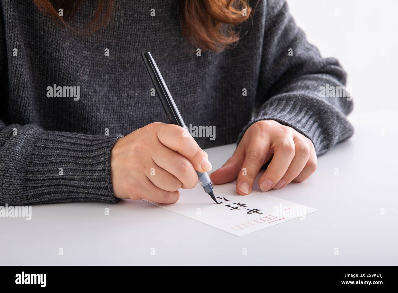 Woman writing a letter Stock Photo - Alamy
