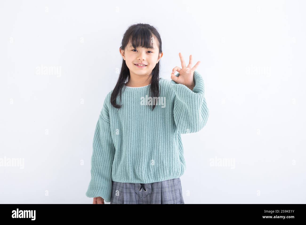 Child making OK pose Stock Photo - Alamy