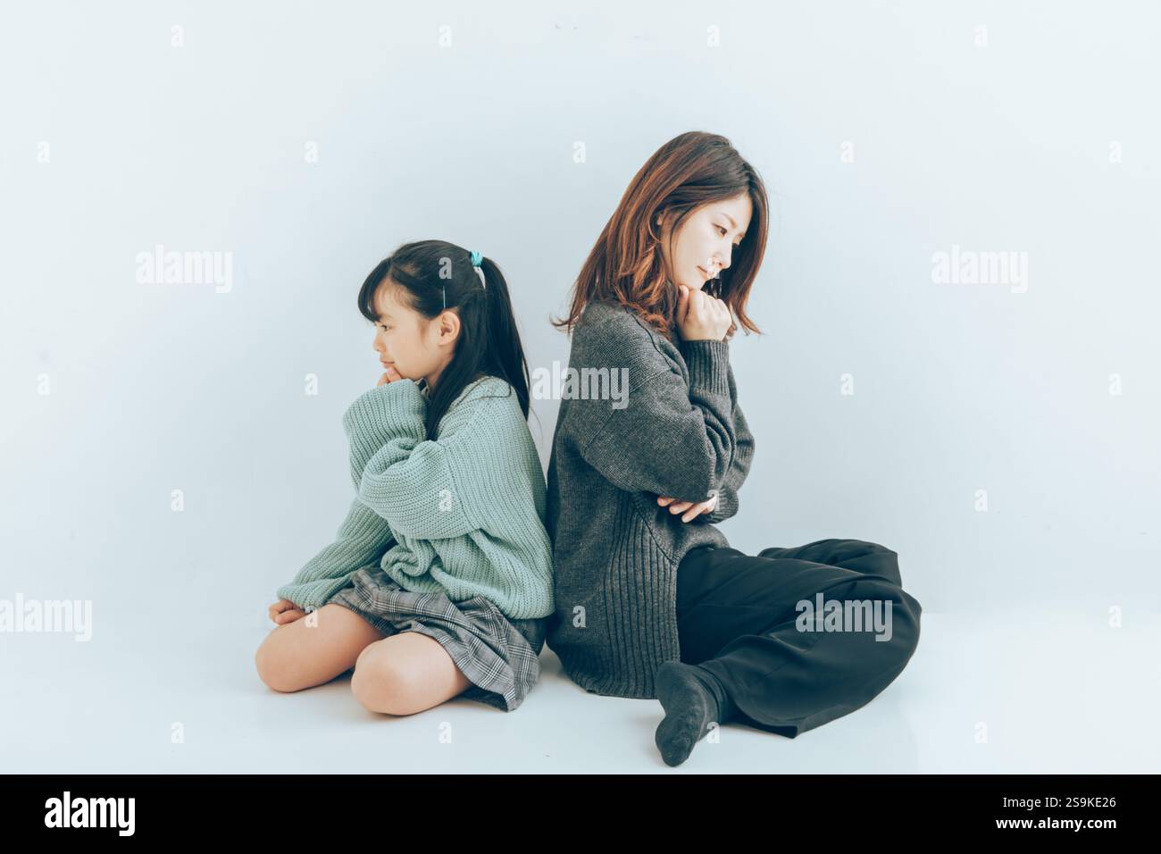 Thinking parents and children Stock Photo - Alamy