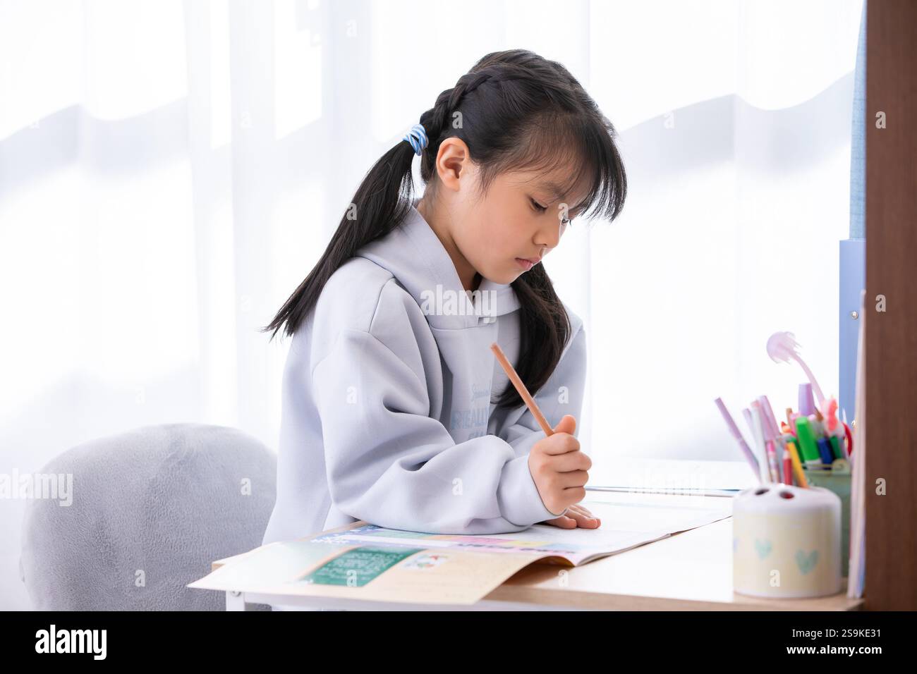 Grumpy child writing hi-res stock photography and images - Alamy