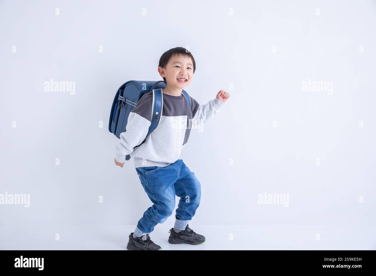 Primary schools boy running away Stock Photo - Alamy
