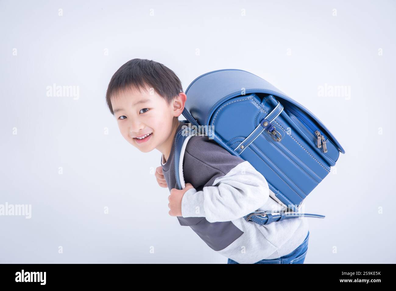 Smiling primary school boy Stock Photo - Alamy
