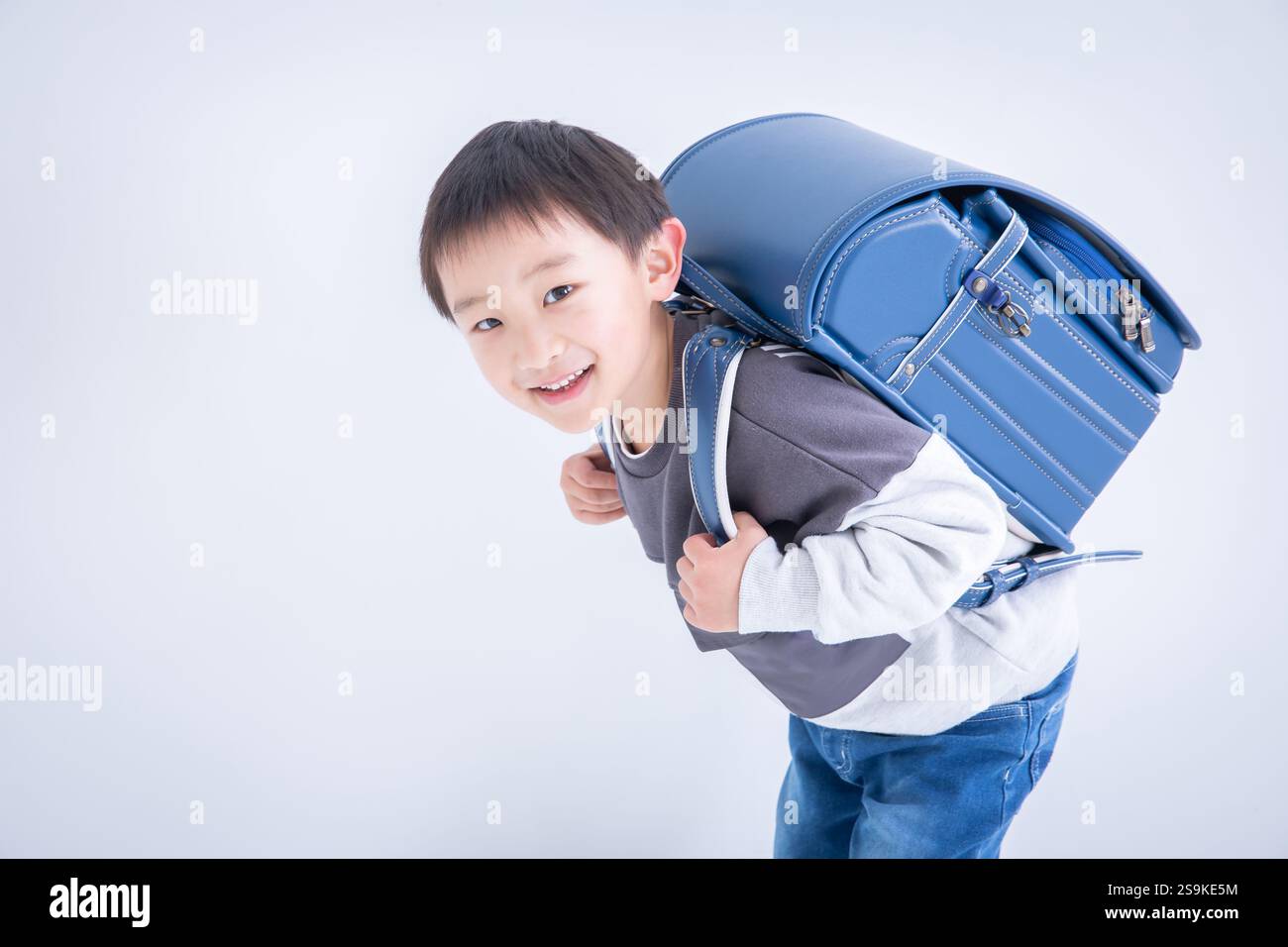Smiling primary school boy Stock Photo - Alamy