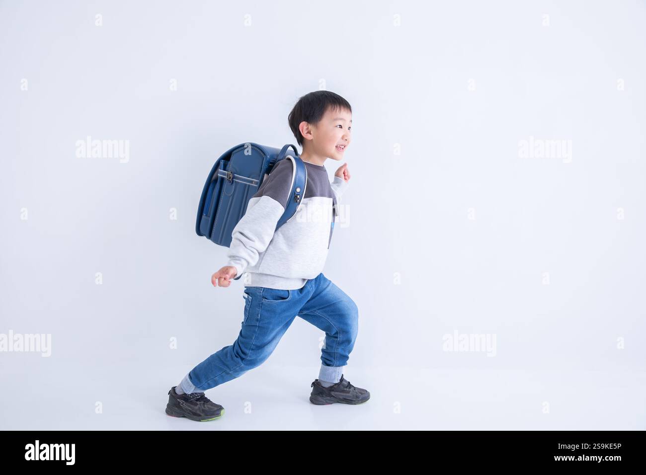 Primary schools boy running away Stock Photo - Alamy