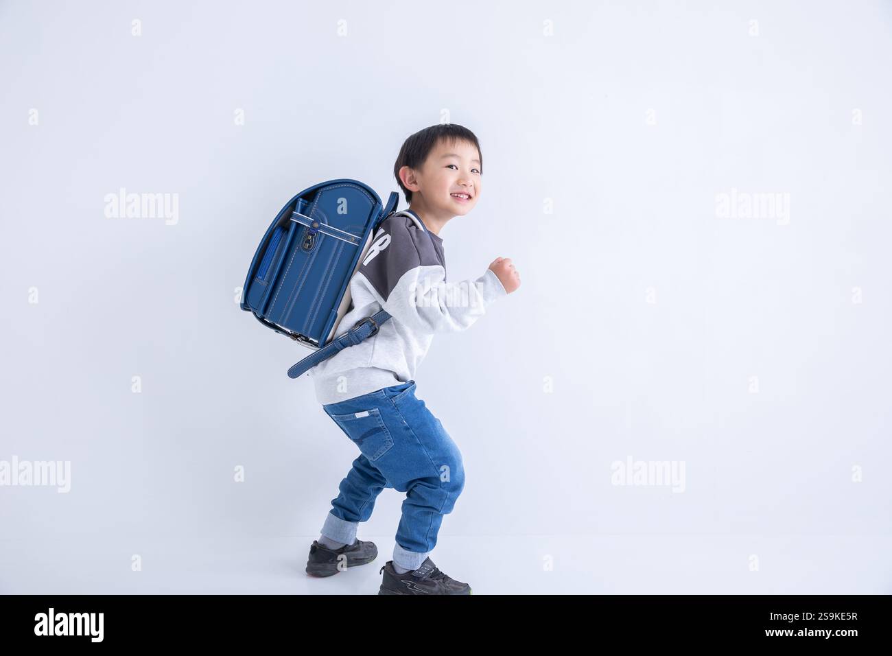 Primary schools boy running away Stock Photo - Alamy
