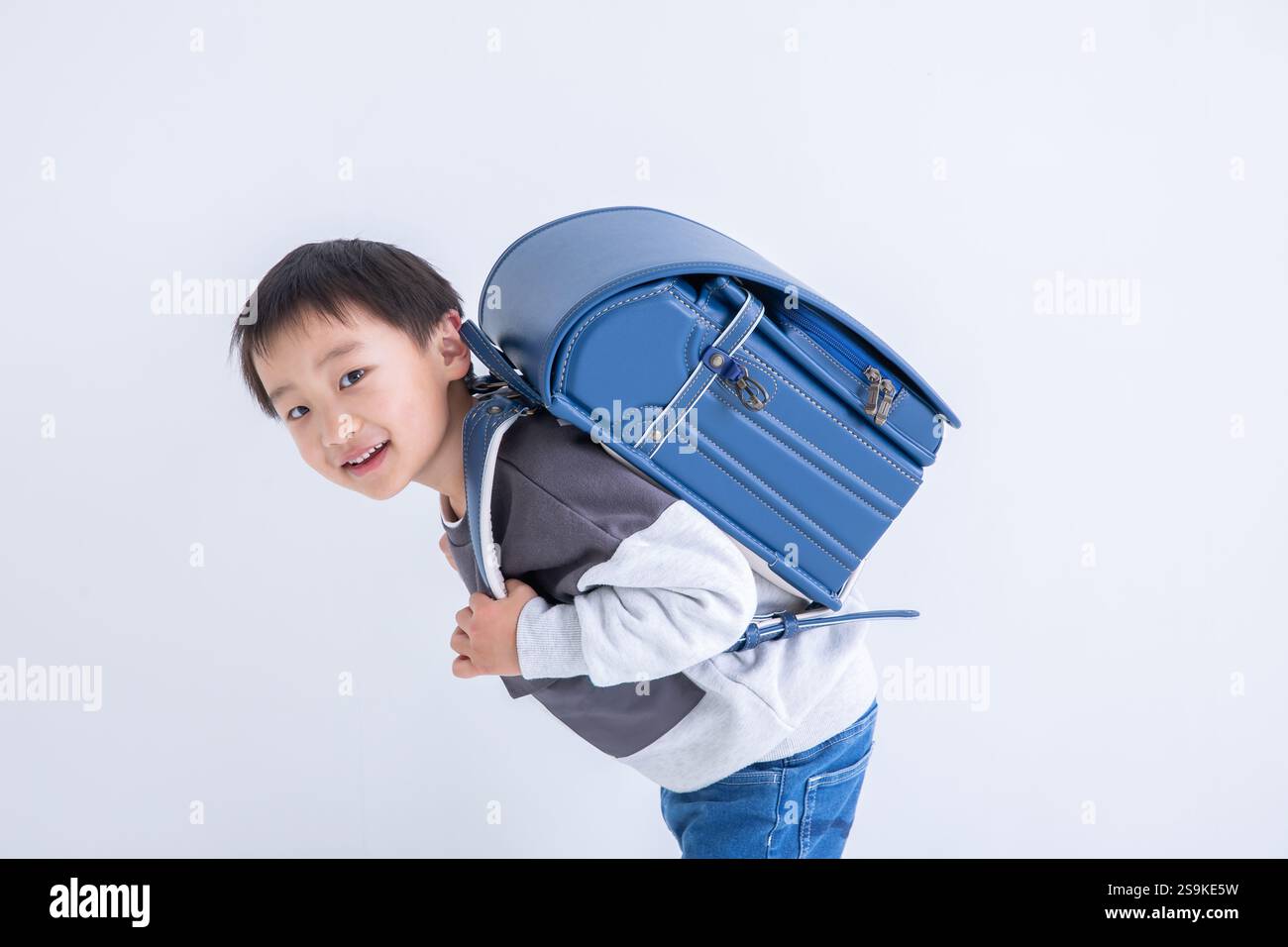 Smiling primary school boy Stock Photo - Alamy