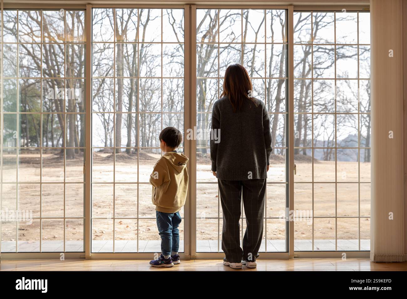 Parent and child Back view Stock Photo - Alamy