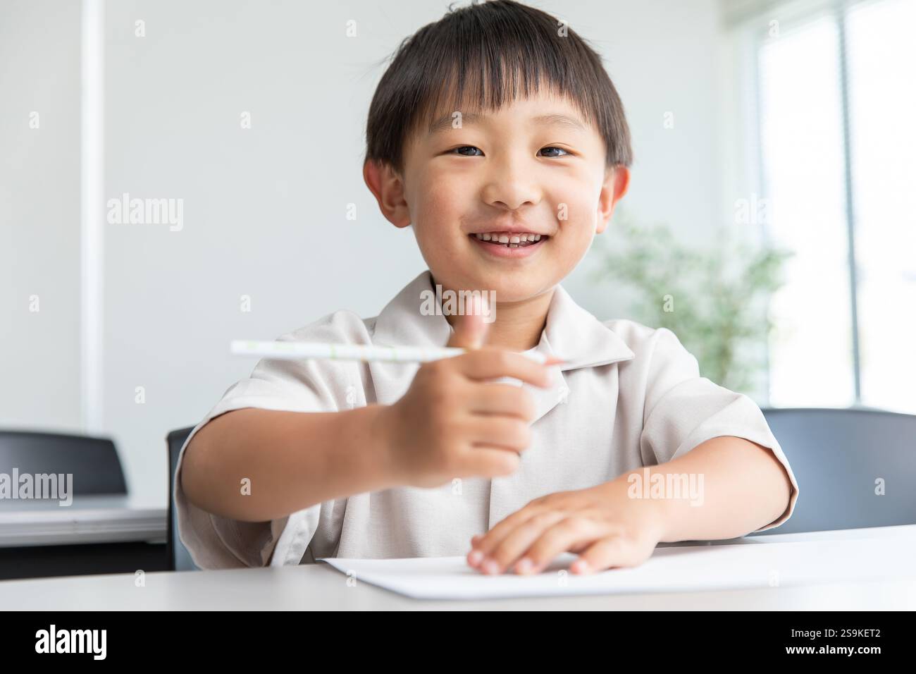 Boy studying at his desk Stock Photo - Alamy