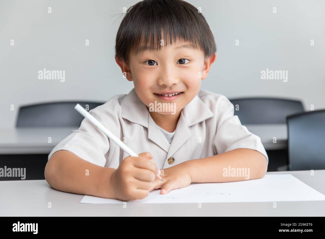 Boy studying at his desk Stock Photo - Alamy