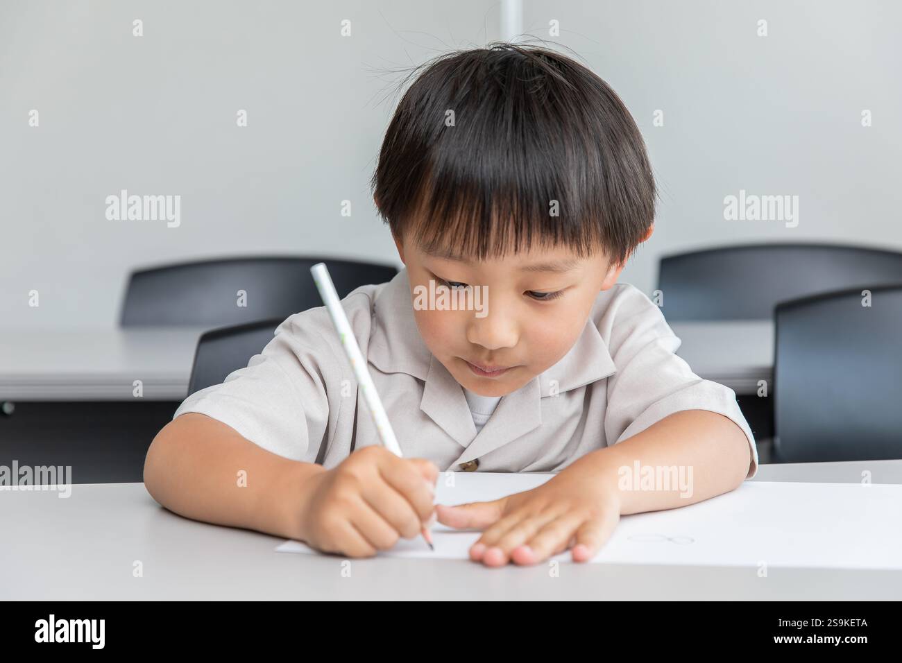 Primary schools student doing homework Stock Photo - Alamy