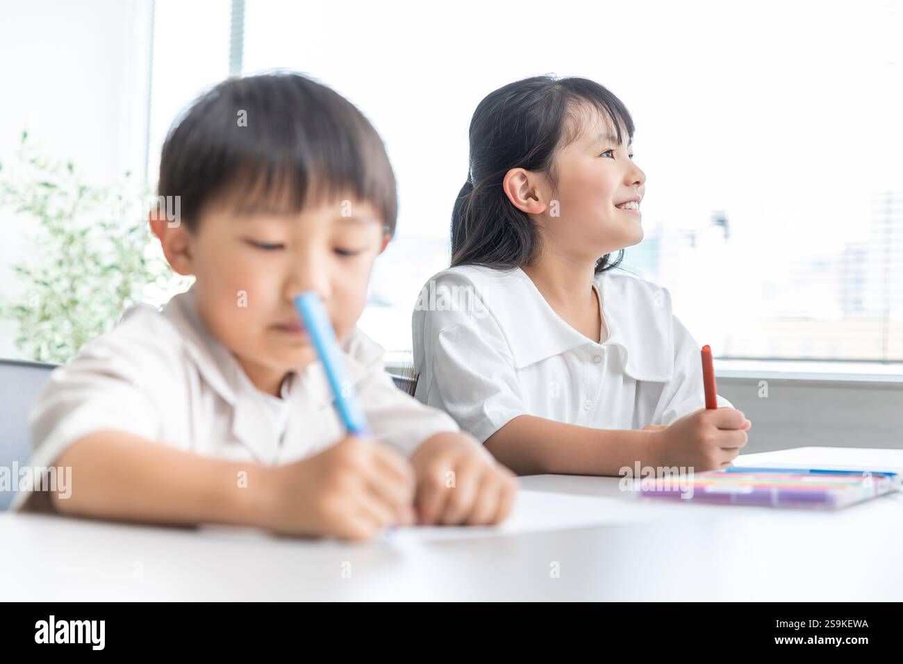 Two siblings study classroom hi-res stock photography and images - Alamy