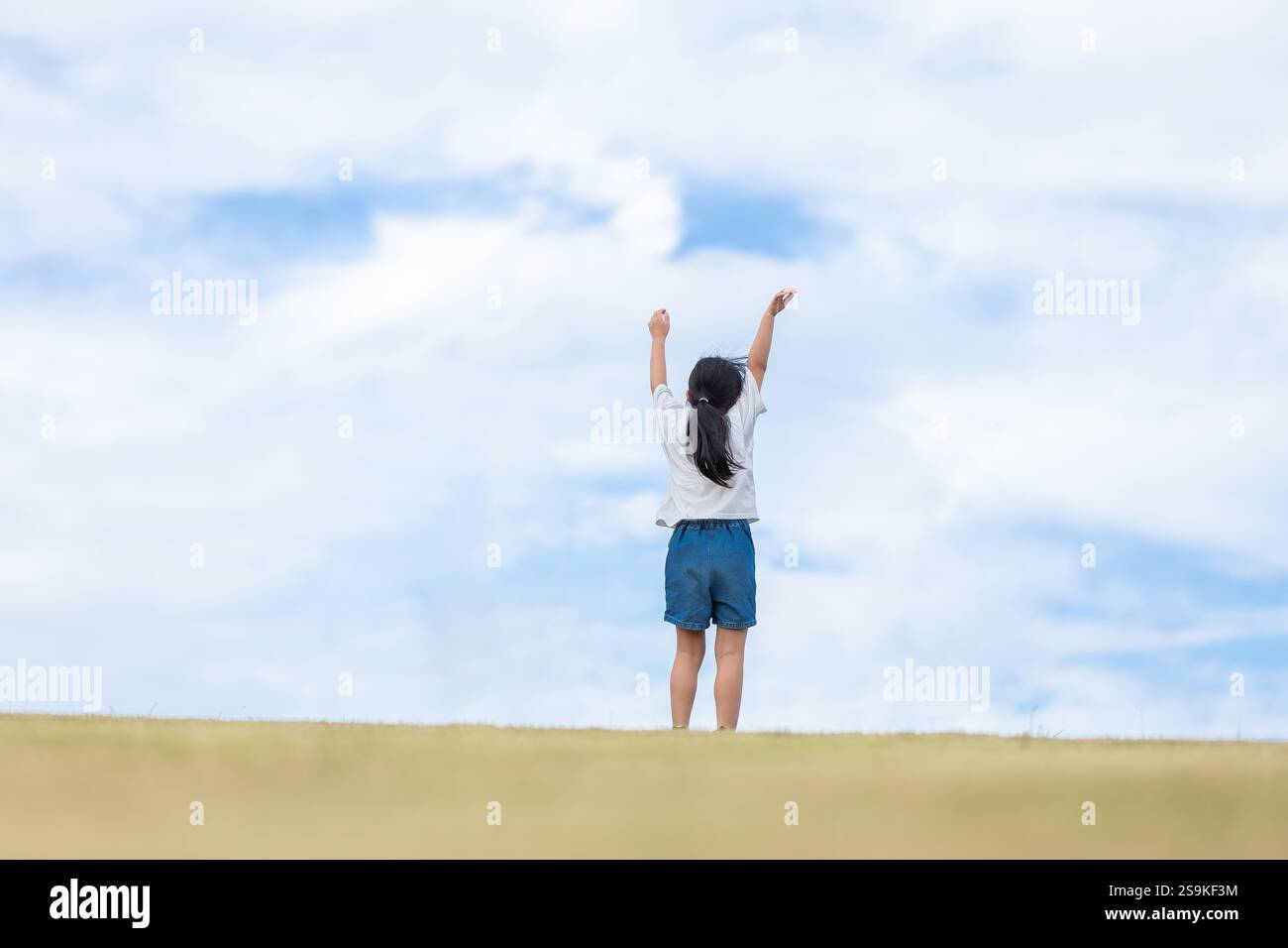 Child stretching tall hi-res stock photography and images - Alamy