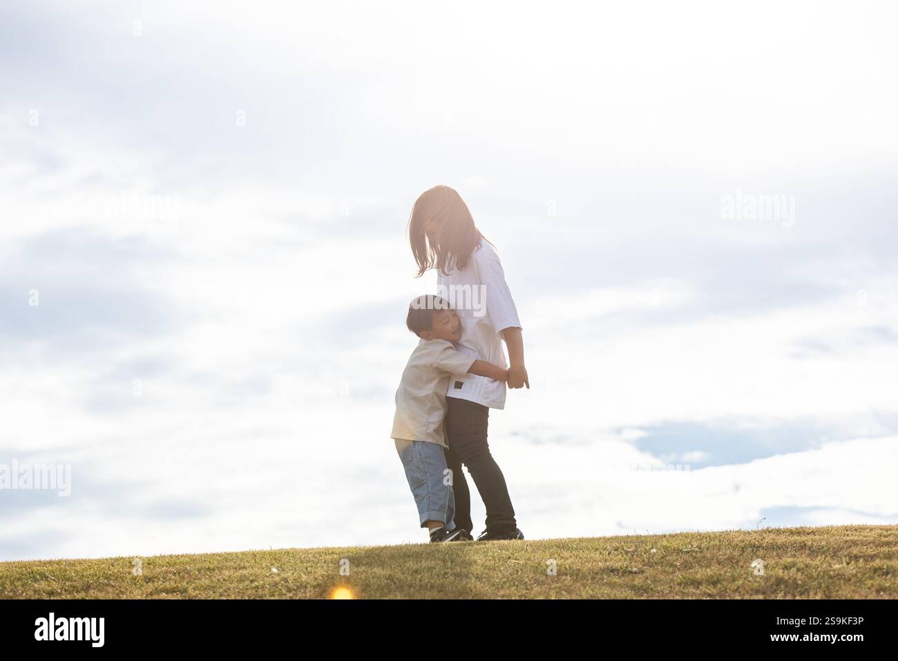 Child hugging her mother Stock Photo - Alamy