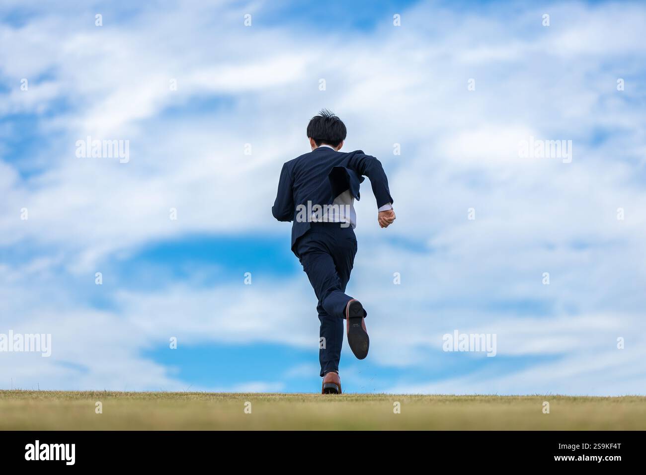 Back view businessman running hi-res stock photography and images - Alamy