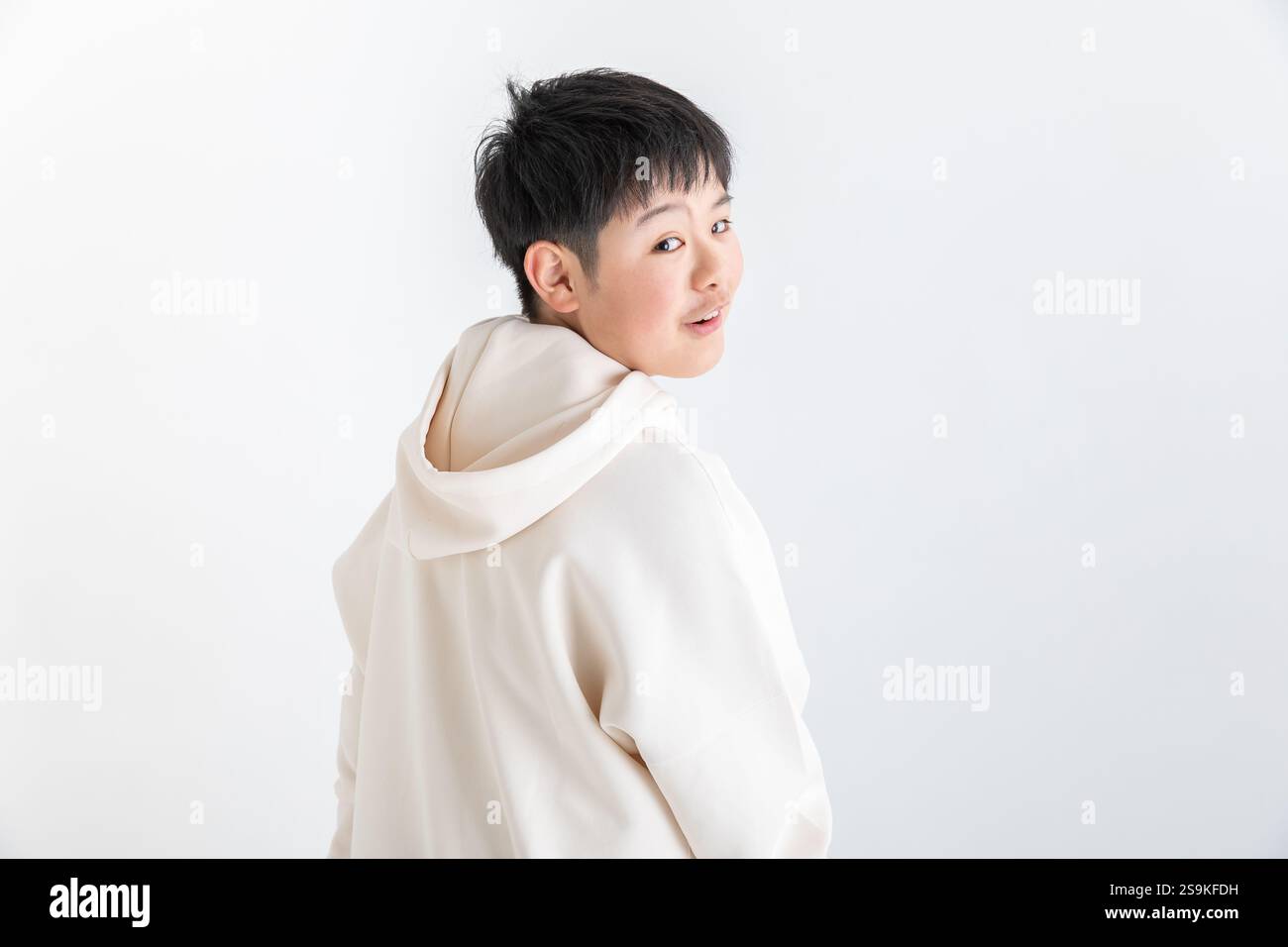 Boy looking back Stock Photo - Alamy