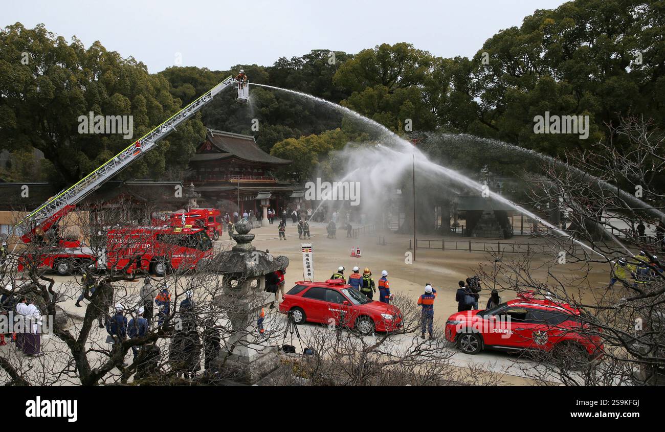 Priests and shrine maiden conduct a firefighting drill at the ground of ...
