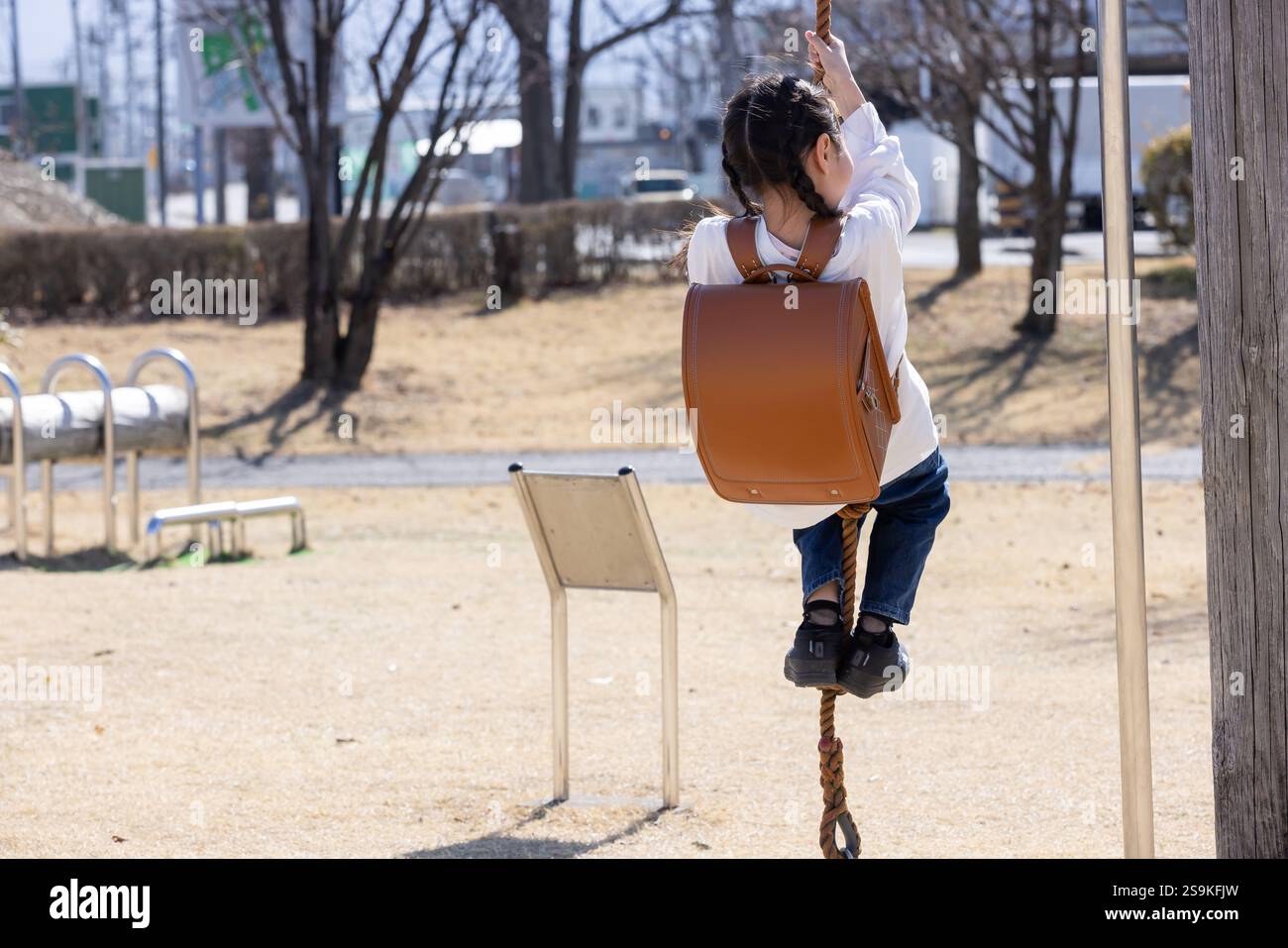 Primary school children playing in park Stock Photo - Alamy