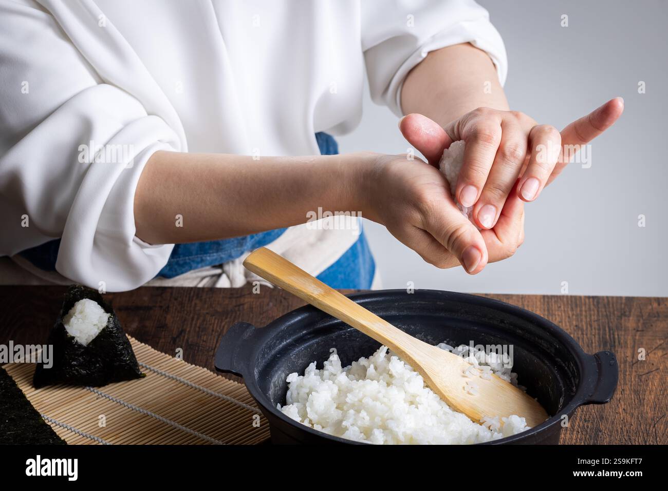 Hand making onigiri Japanese food Stock Photo - Alamy