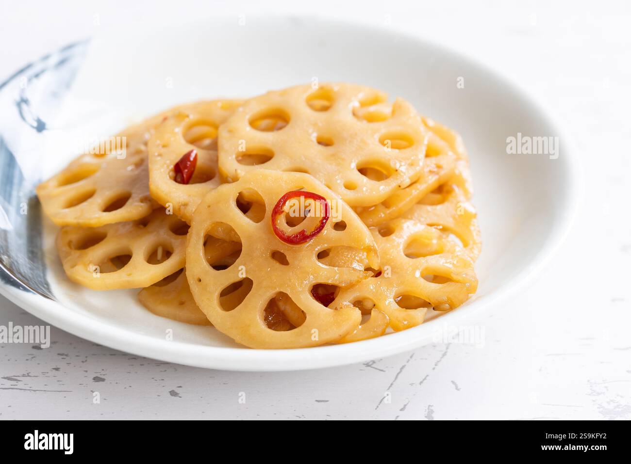 Sauteed lotus root kinpira Japanese food Stock Photo - Alamy