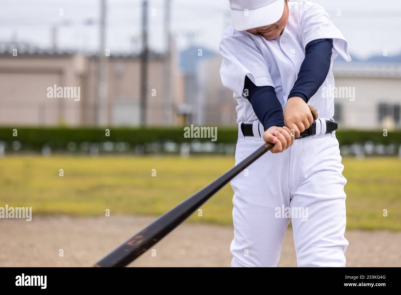 Baseball boy swinging a baseball Stock Photo - Alamy