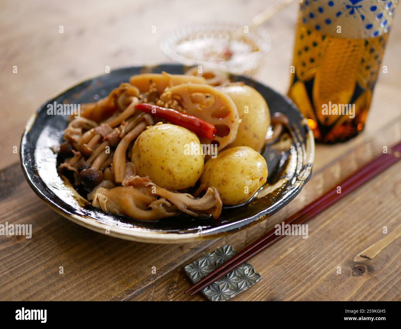Braised new potatoes with sweet and spicy sauce Stock Photo - Alamy