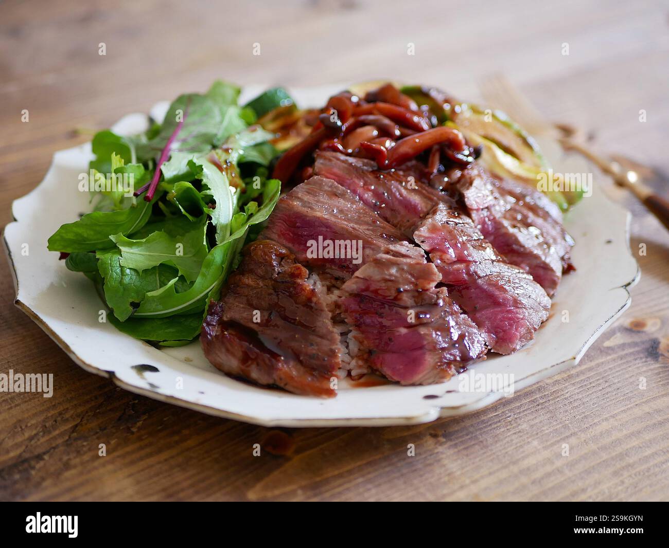 Beef steak on rice Stock Photo - Alamy