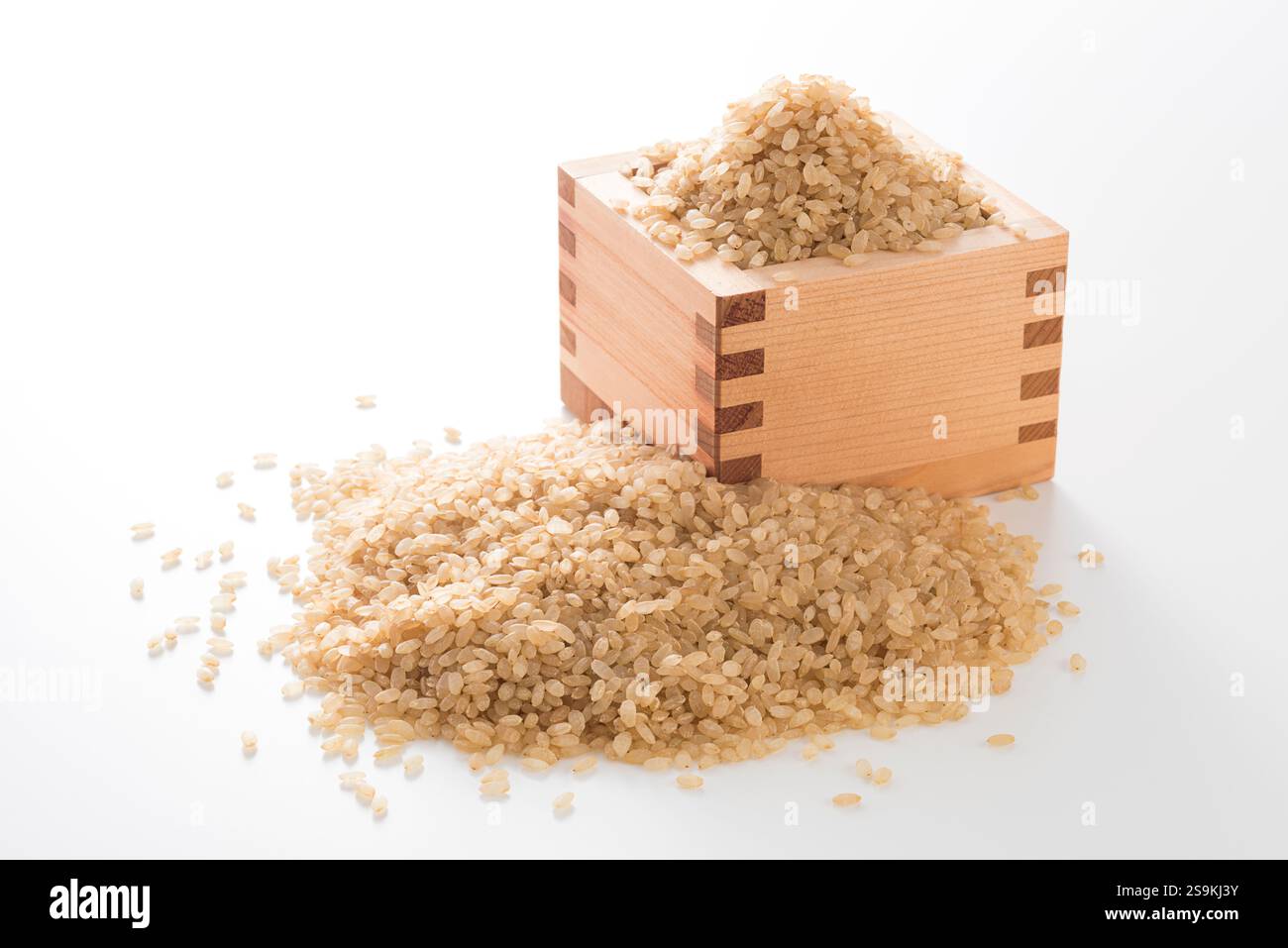 Wooden Masu and brown rice Stock Photo - Alamy