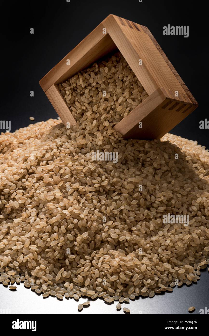 Wooden Masu and brown rice Stock Photo - Alamy