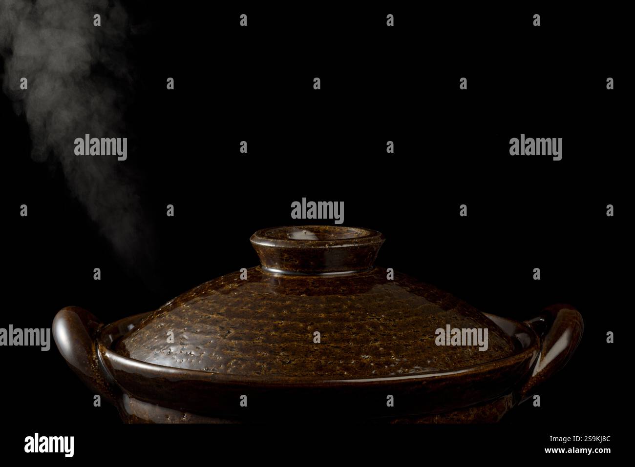 Steam rising from earthenware pot Stock Photo - Alamy