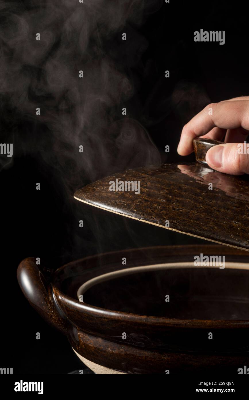 Steam rising from earthenware pot Stock Photo - Alamy