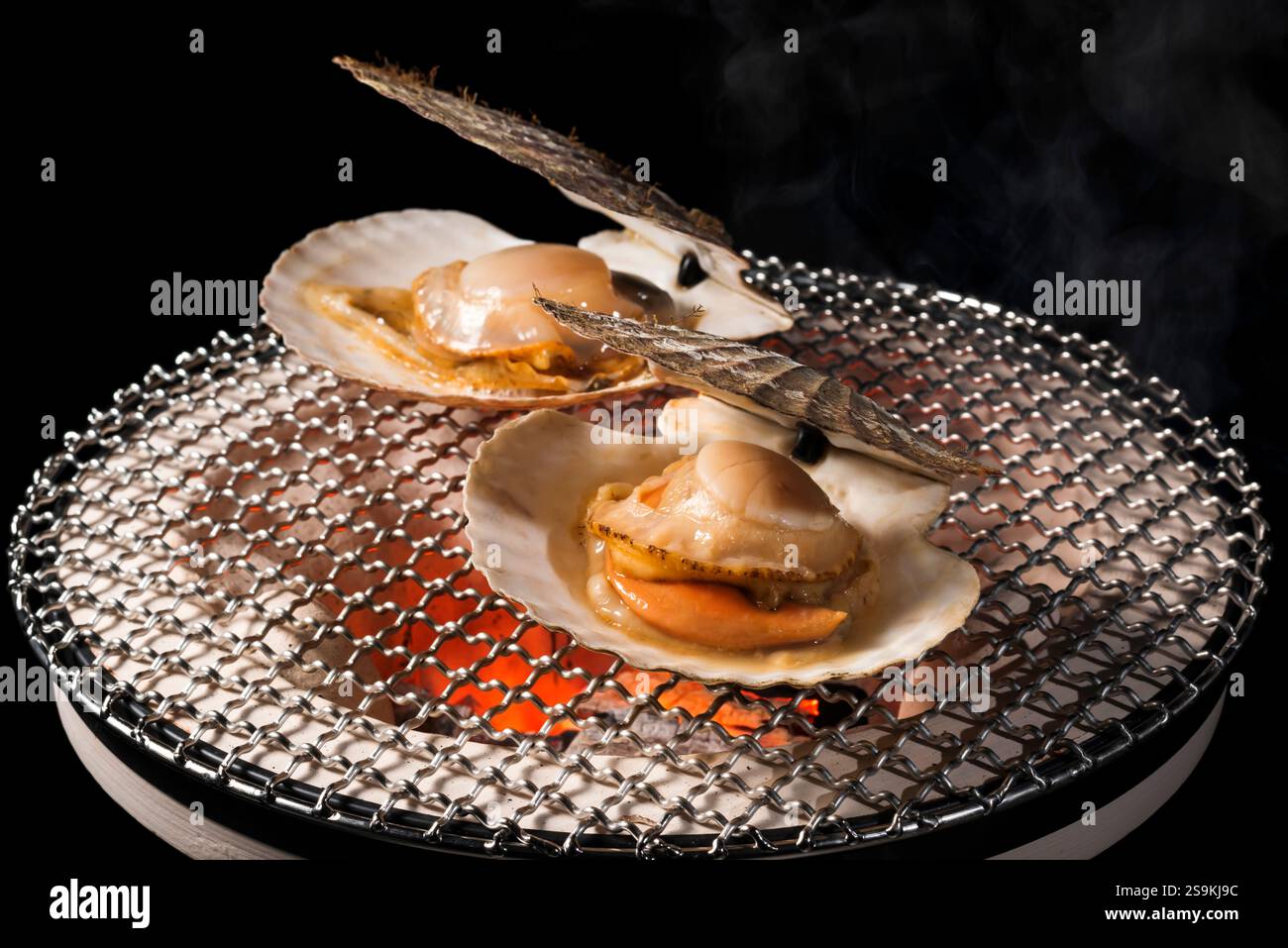 Char-grilled scallops with shells Stock Photo - Alamy