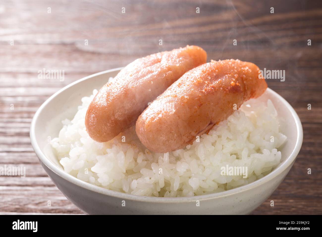 Put Karashi Mentaiko ( Spicy cod roe ) on white rice Stock Photo - Alamy