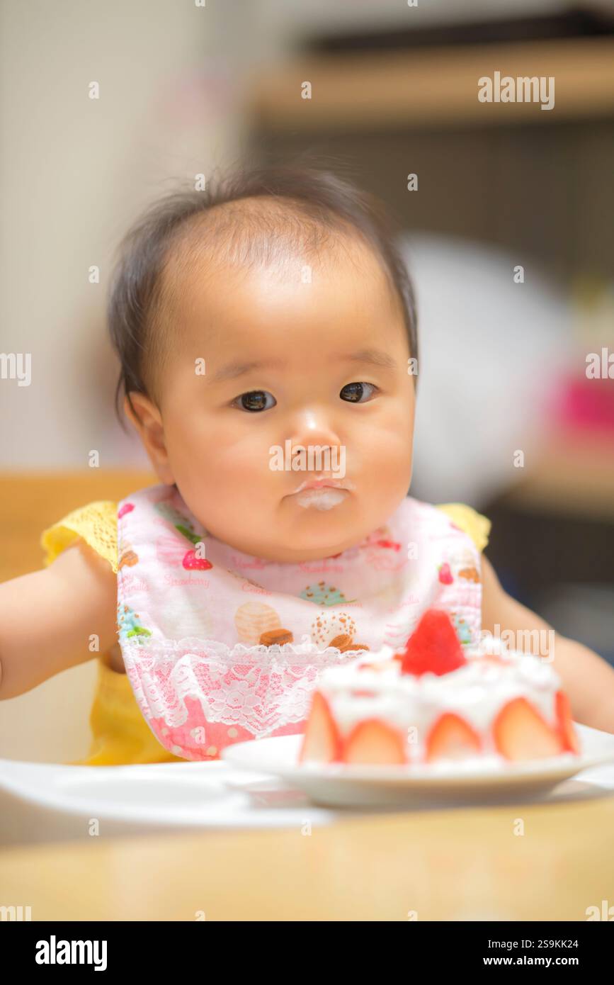 Child eating first birthday cake Stock Photo - Alamy
