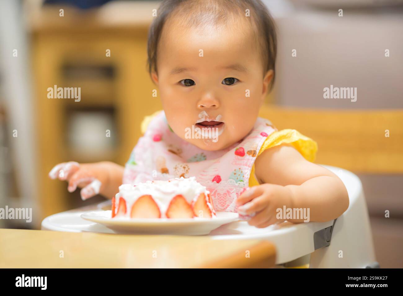 Child eating first birthday cake Stock Photo - Alamy