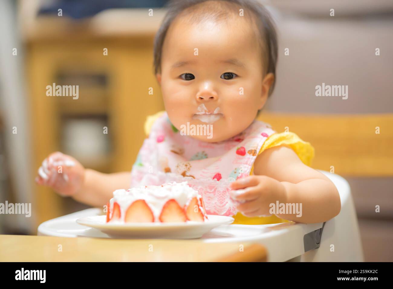 Child eating first birthday cake Stock Photo - Alamy