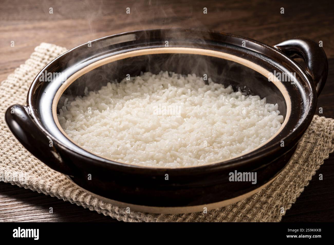 Rice cooked in earthenware pot Stock Photo - Alamy
