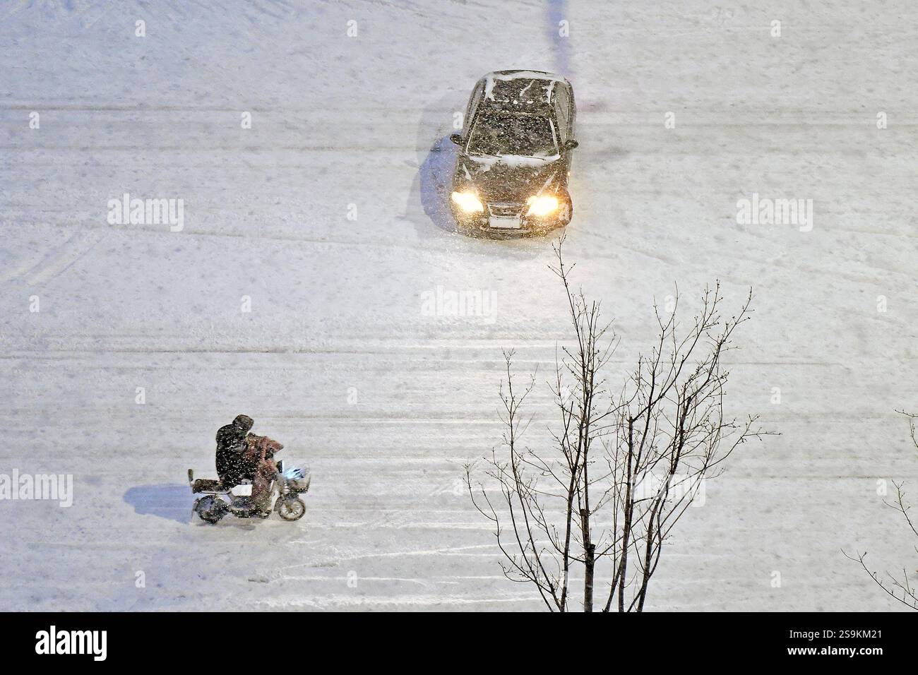 YANTAI, CHINA - JANUARY 27, 2025 - People travel in the snow on a ...
