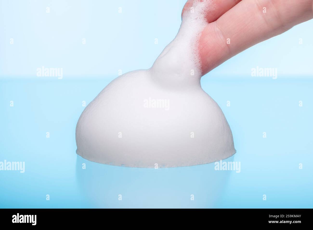 Taking bubbles with fingers Stock Photo - Alamy
