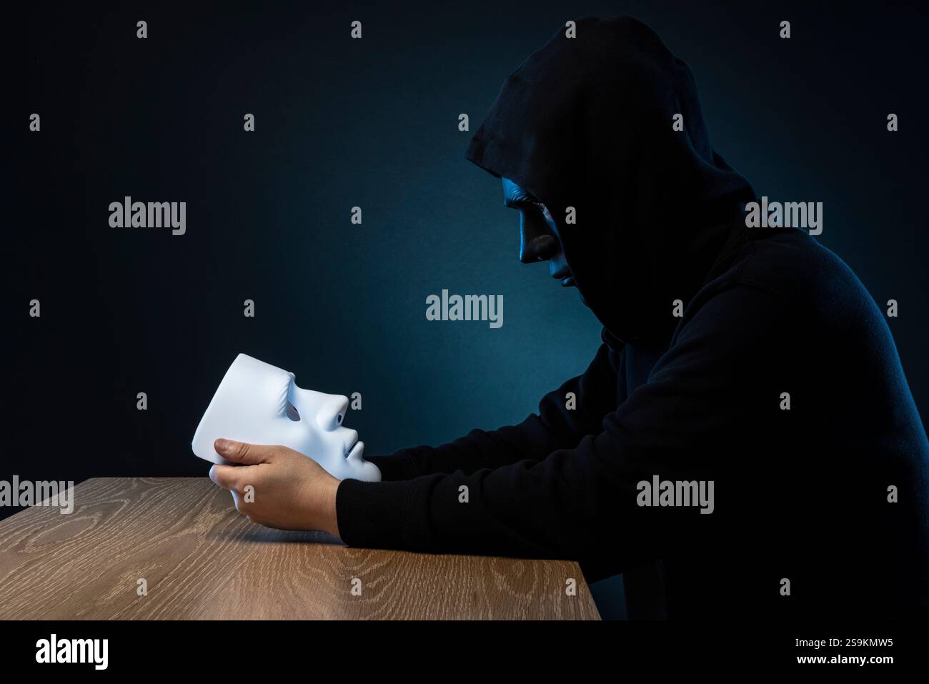 Masked man table hi-res stock photography and images - Alamy