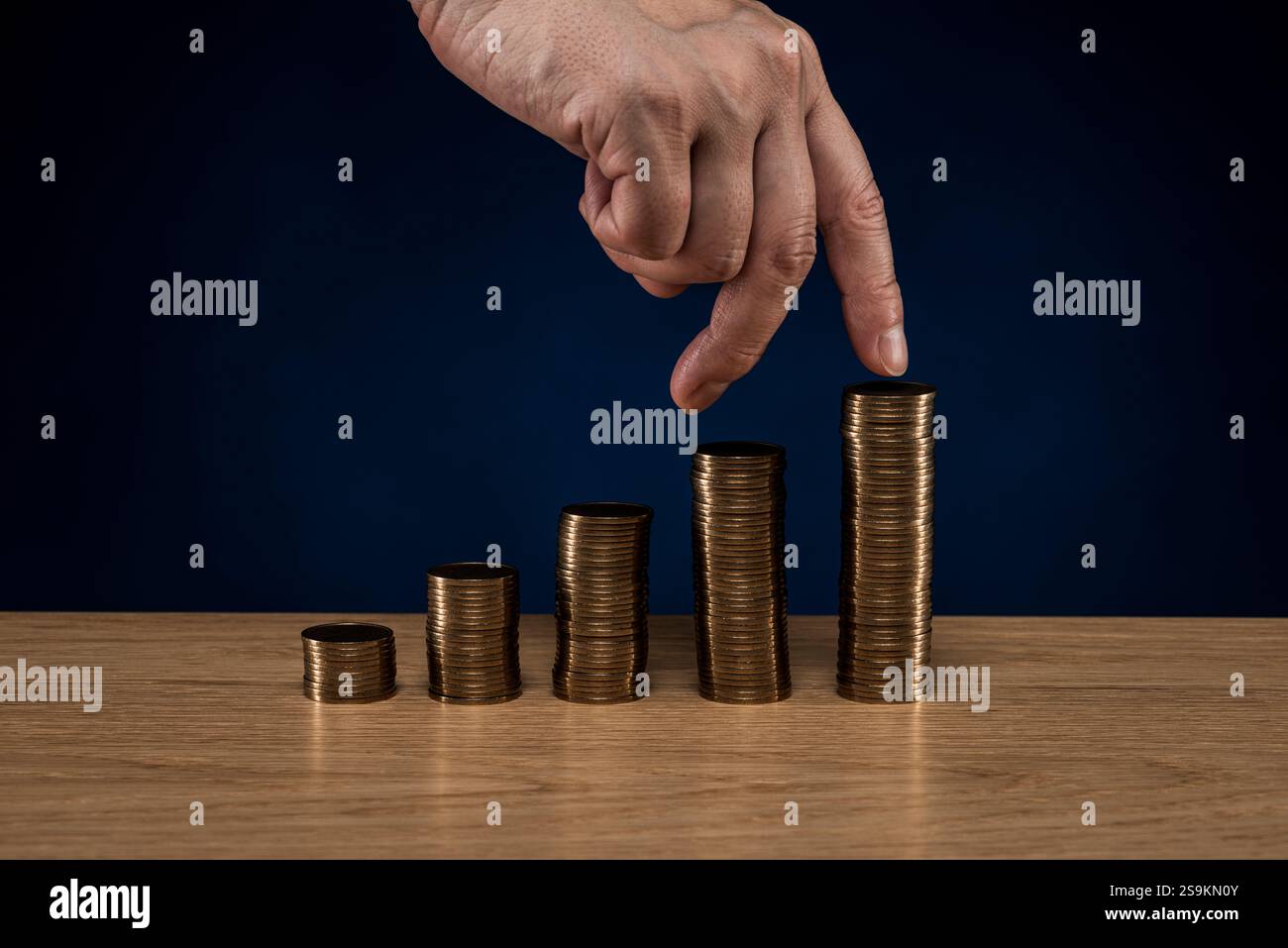 Gold coin Hand Stock Photo - Alamy