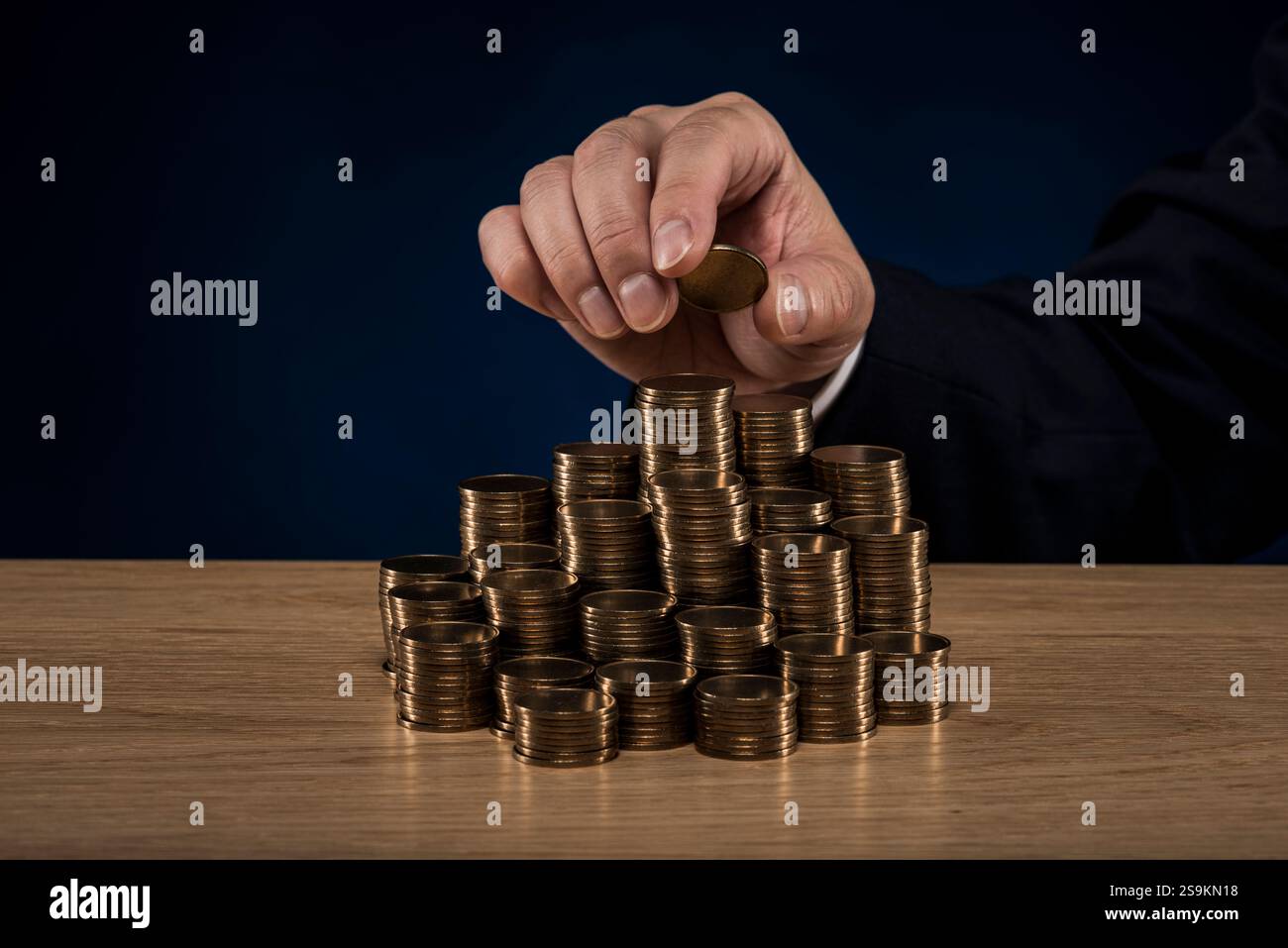 Gold coin Hand Stock Photo - Alamy