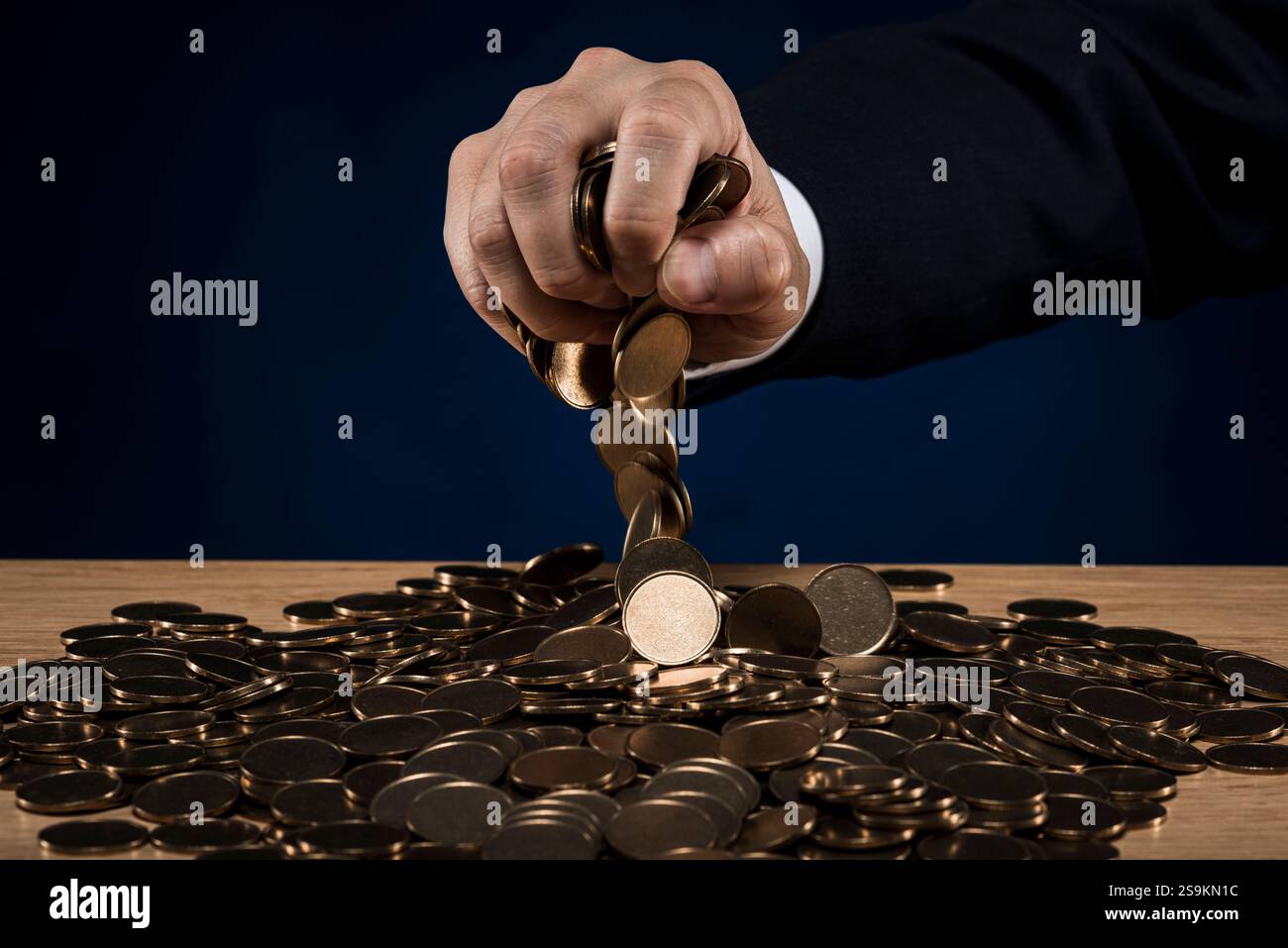 Gold coin Hand Stock Photo - Alamy