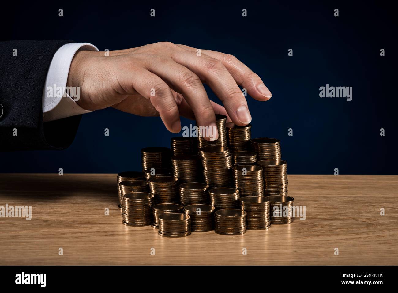 Gold coin Hand Stock Photo - Alamy