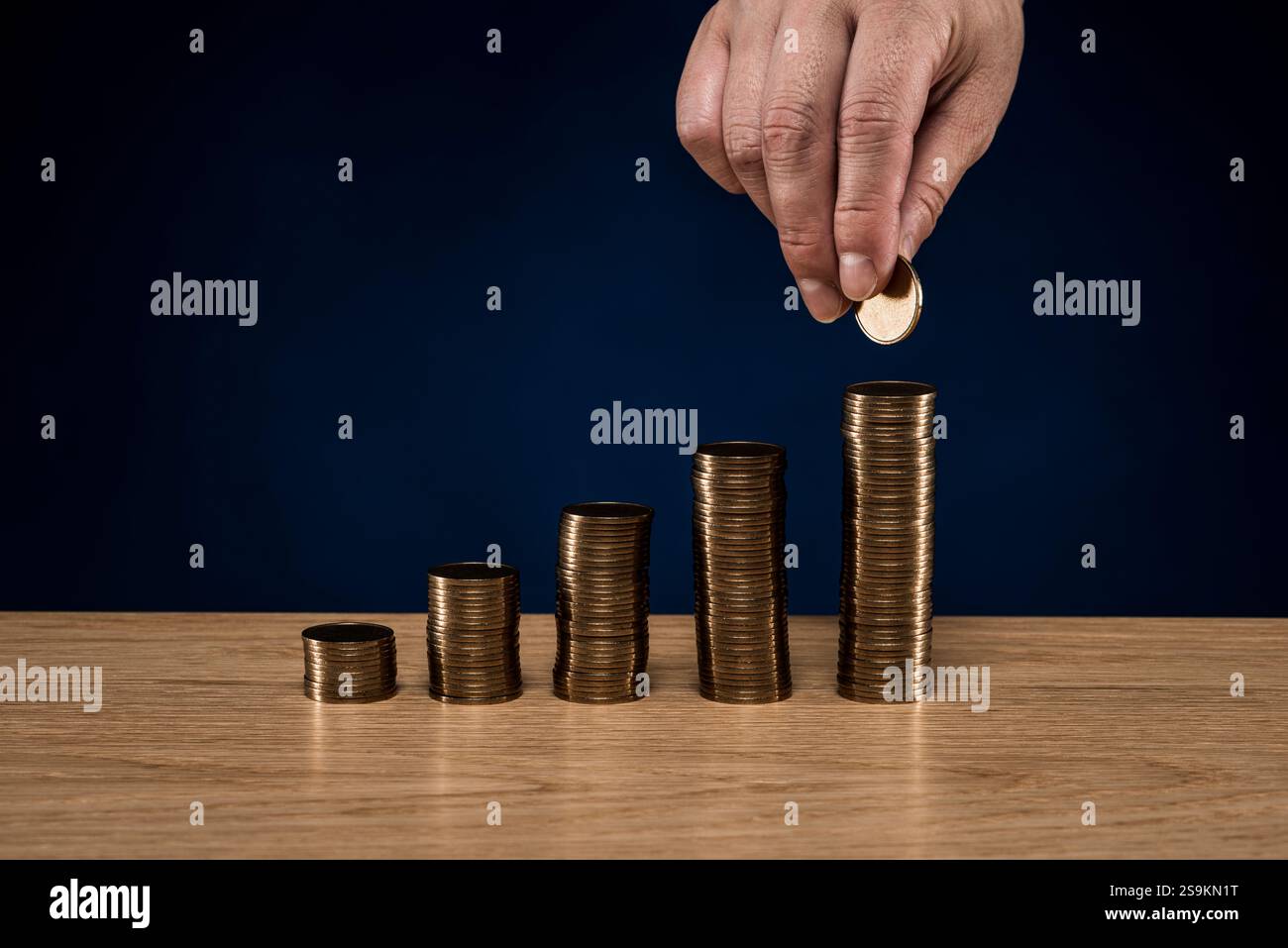 Gold coin Hand Stock Photo - Alamy