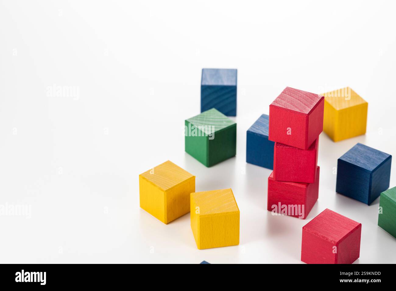 Stacking colourful blocks Stock Photo - Alamy