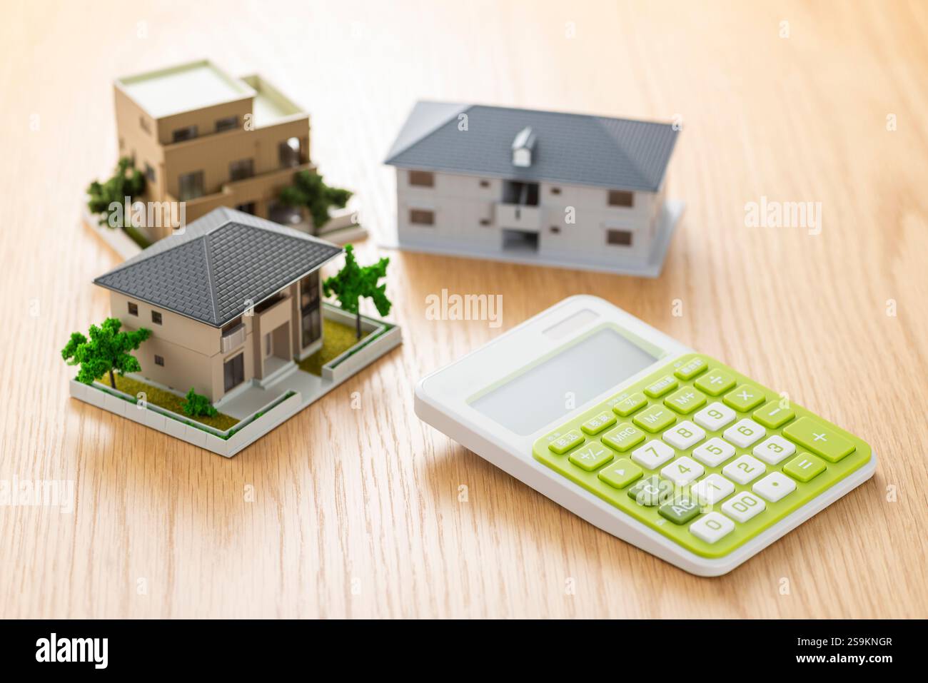 Housing model and calculator Stock Photo - Alamy