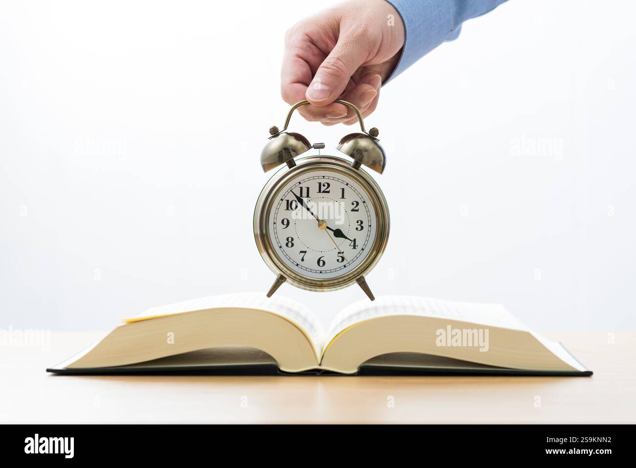 Businessman Reading Clock Stock Photo - Alamy